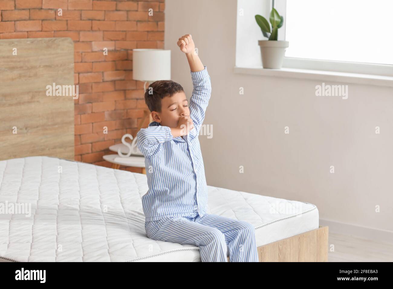 Morning of sleepy little boy in bedroom Stock Photo - Alamy