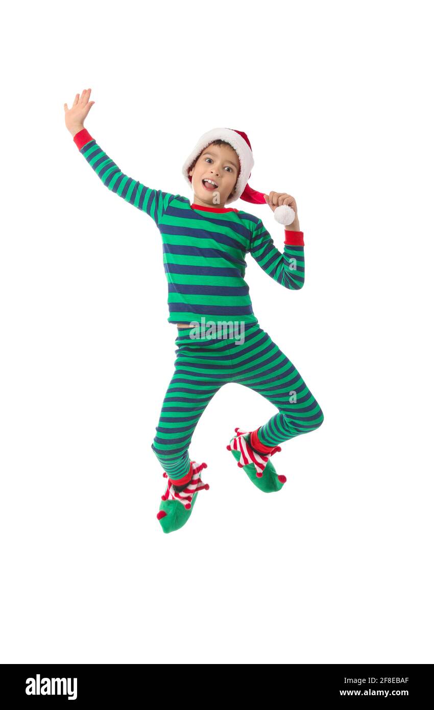 Jumping little boy in Christmas elf costume on white background Stock ...