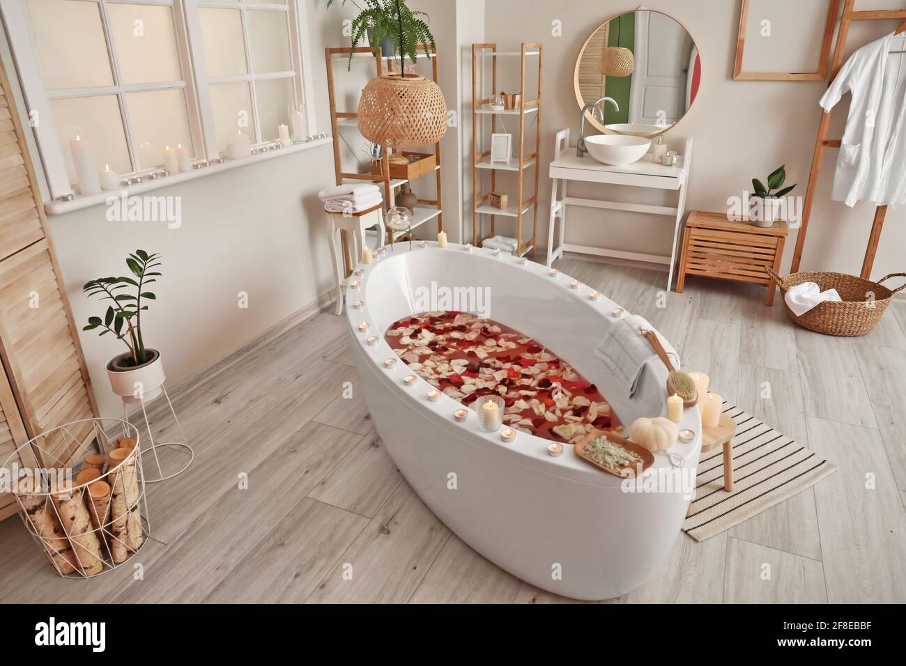 Interior of modern bathroom with burning candles Stock Photo - Alamy