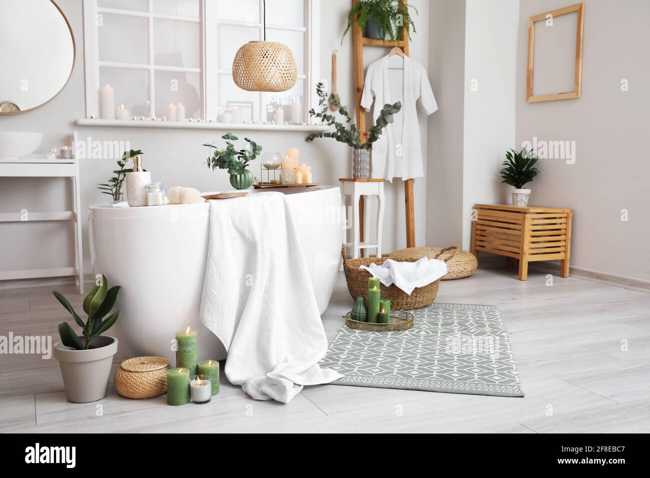 Interior of modern bathroom with burning candles Stock Photo - Alamy