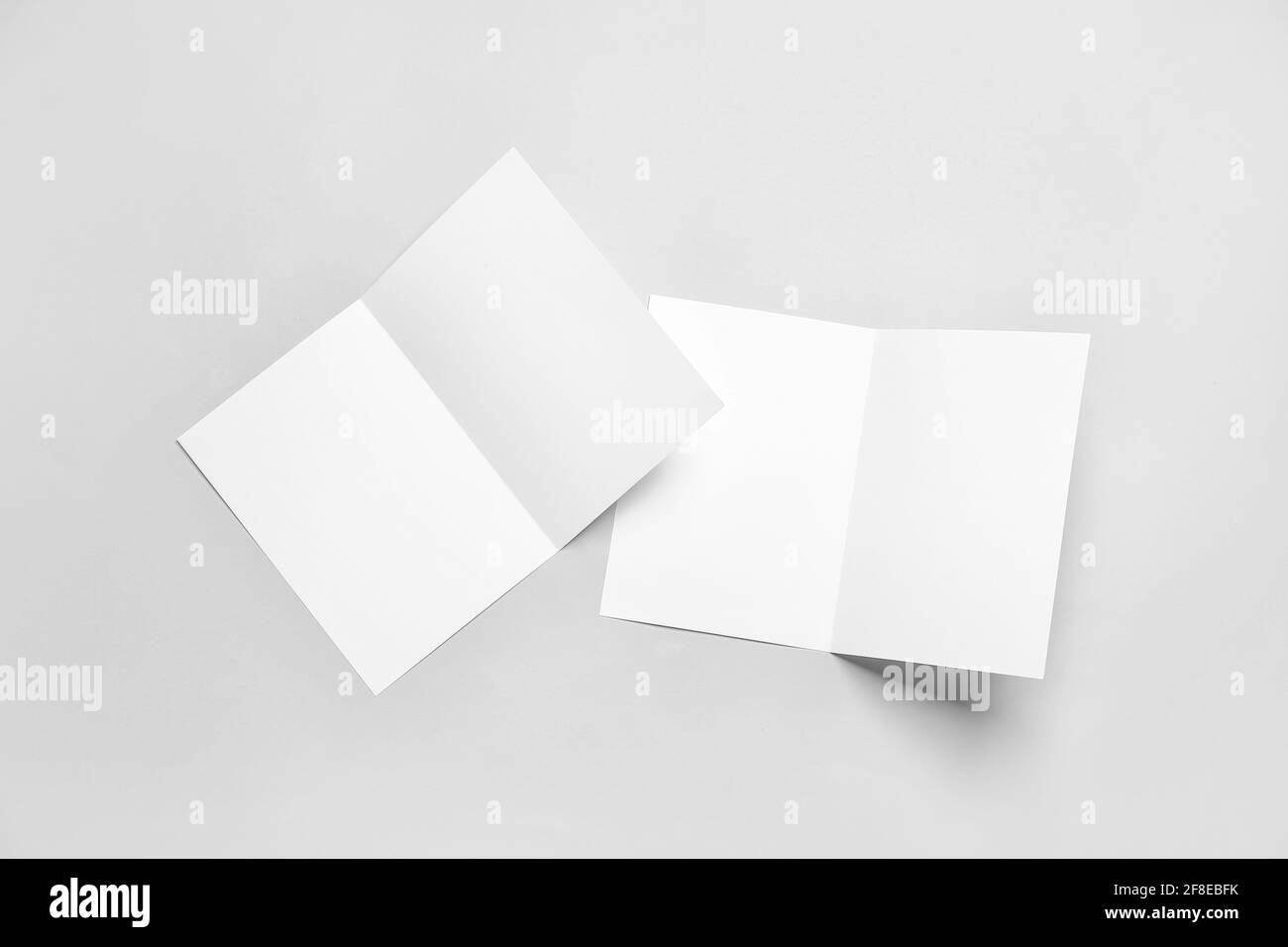 Blank brochures on light background Stock Photo - Alamy