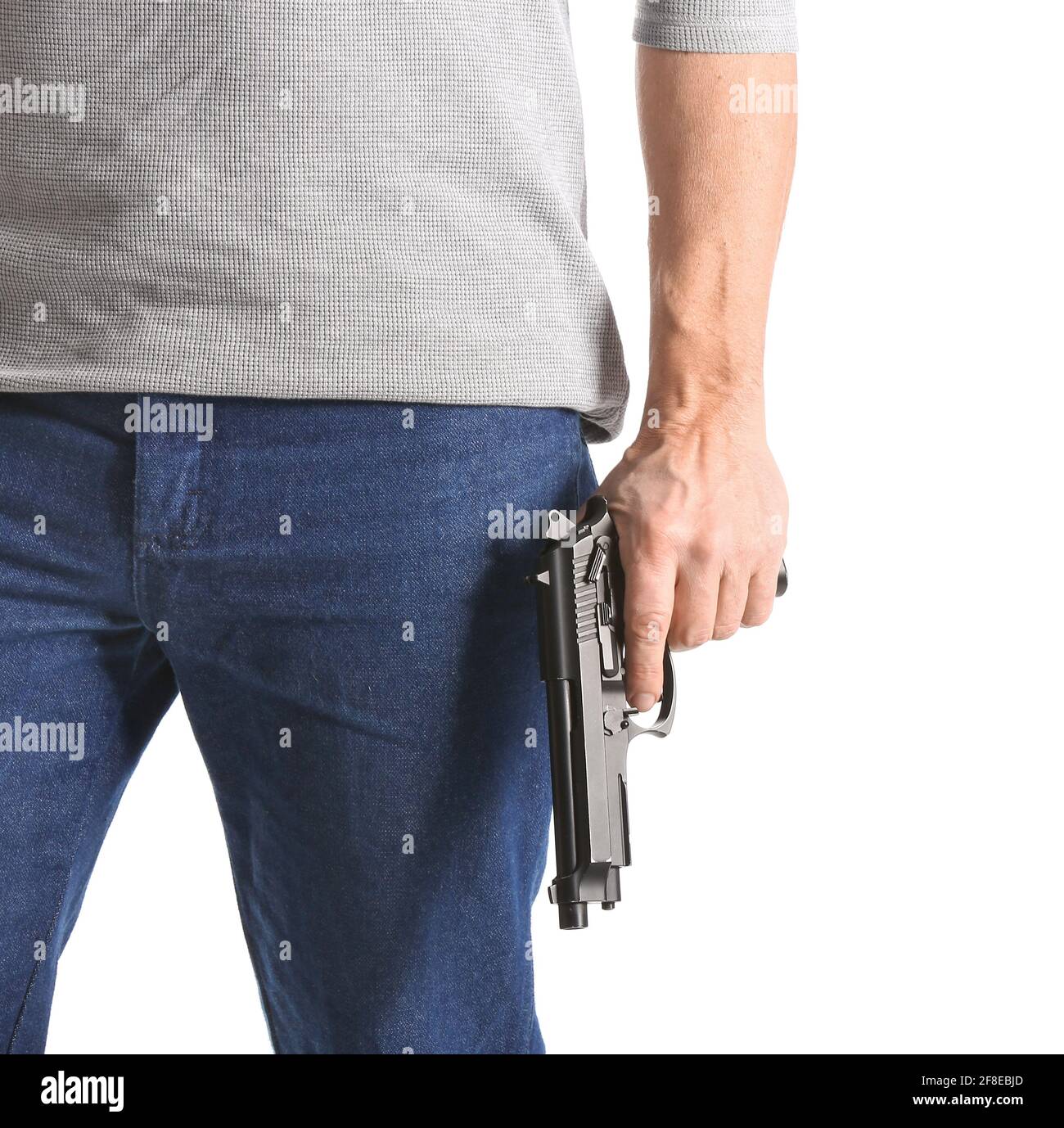 Man with gun on white background Stock Photo - Alamy
