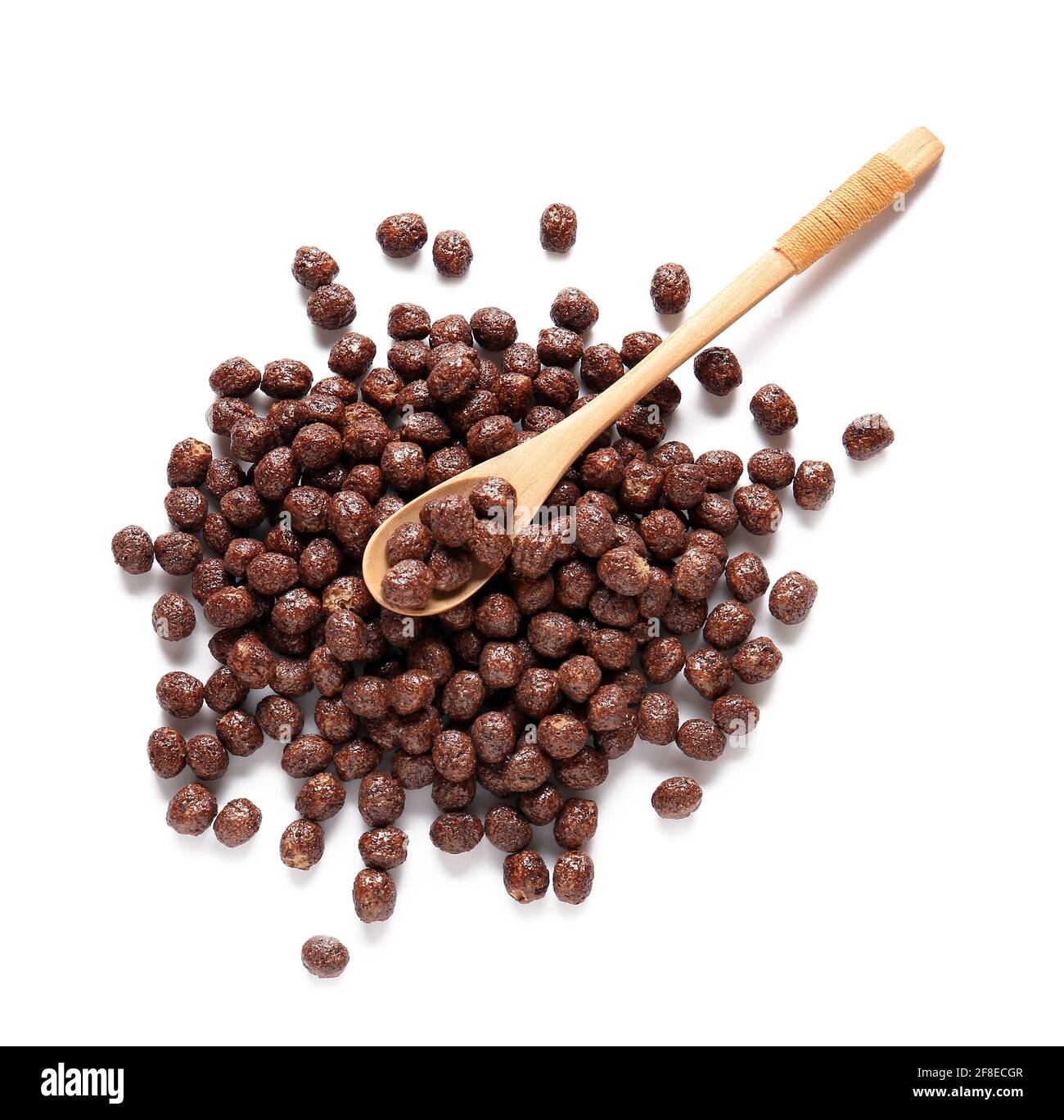 Heap of chocolate corn balls and spoon on white background Stock Photo ...