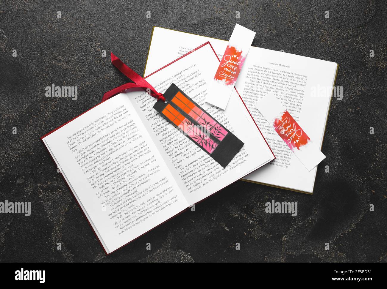 Books with bookmarks on dark background Stock Photo - Alamy