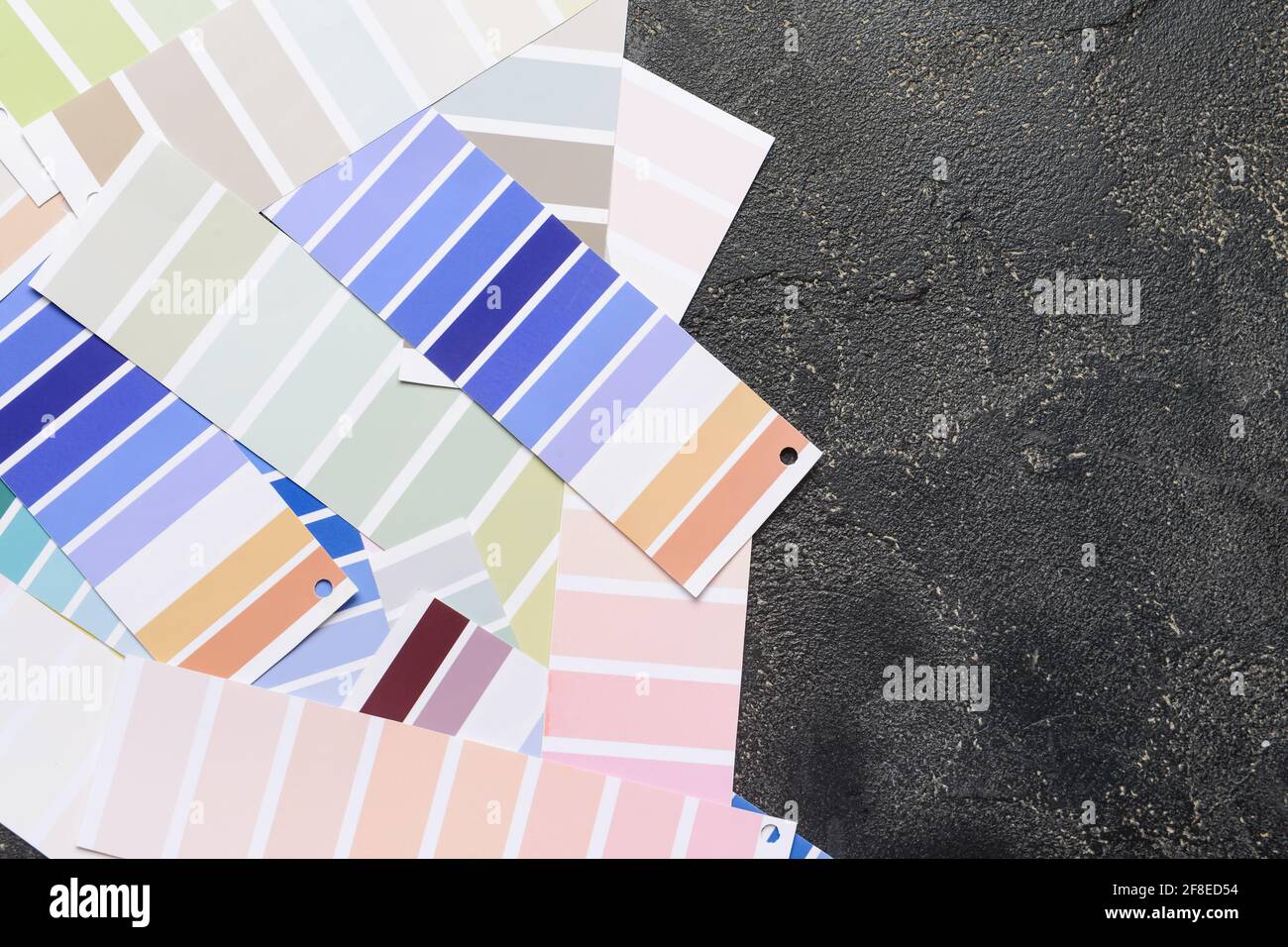 Paint color samples on dark background Stock Photo - Alamy