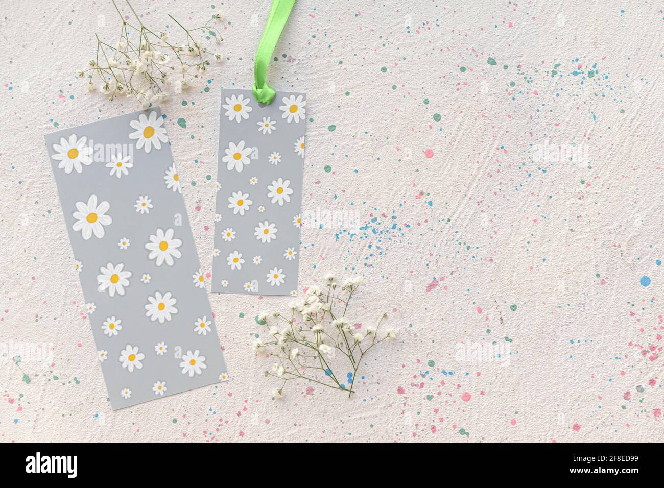 Bookmarks and flowers on light background Stock Photo - Alamy