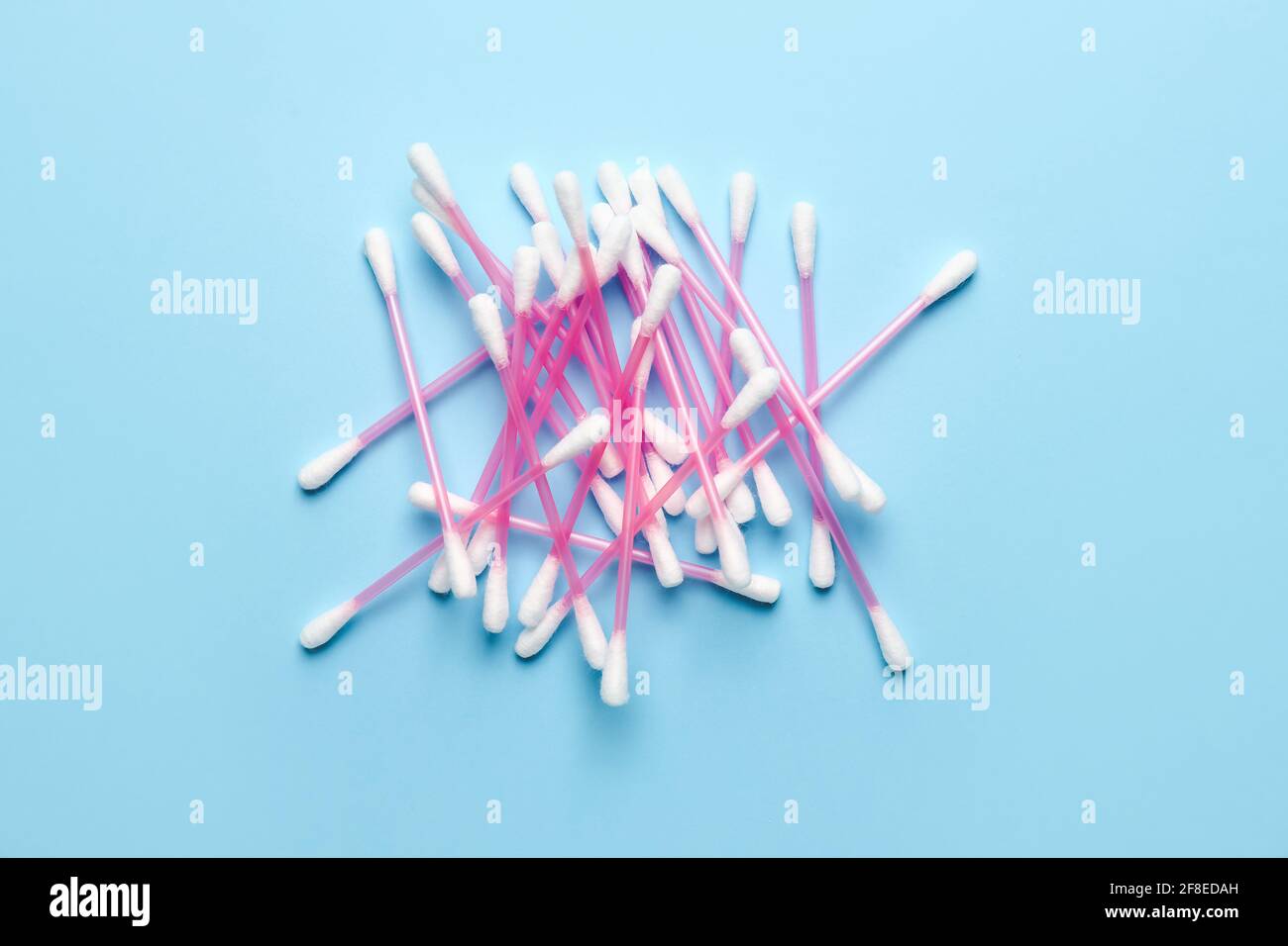 Cotton swabs on color background Stock Photo - Alamy