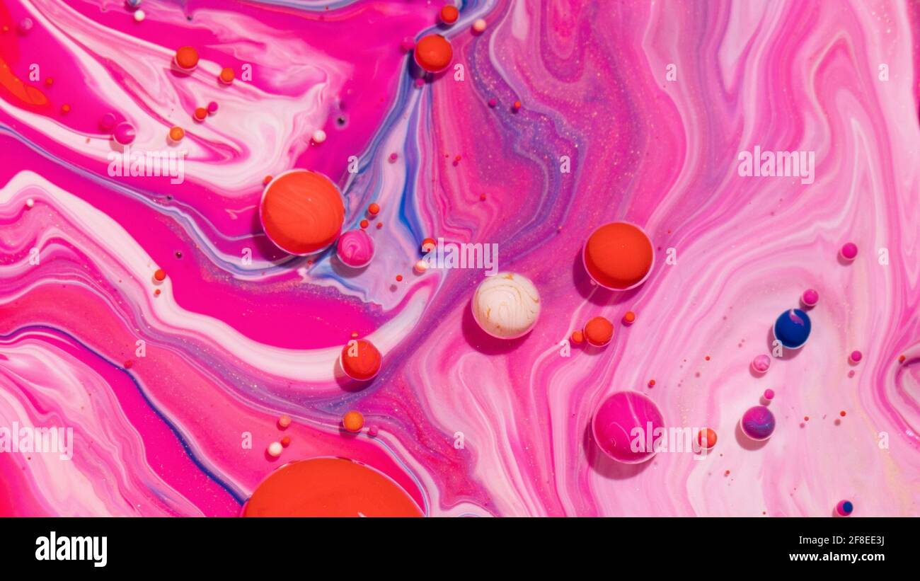 Top view of colorful vibrant rocks on purple background for wallpapers ...