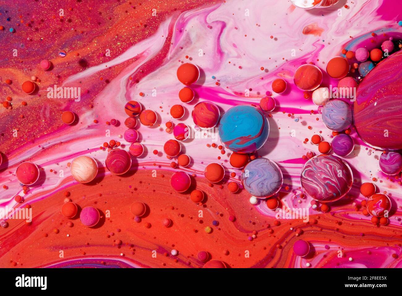 Top view of colorful vibrant rocks on a bright red surface for ...