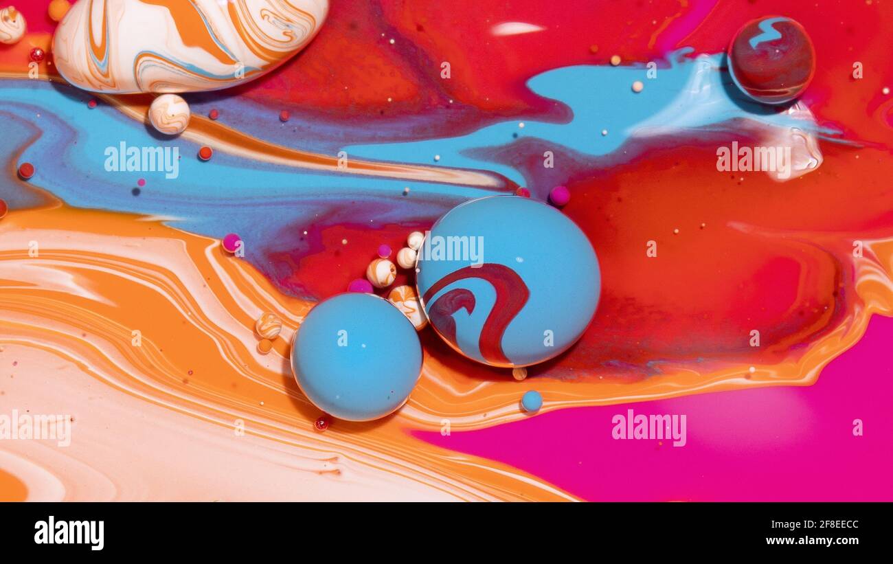 Abstract background of acrylic paint swirl and blobs in oil - a ...