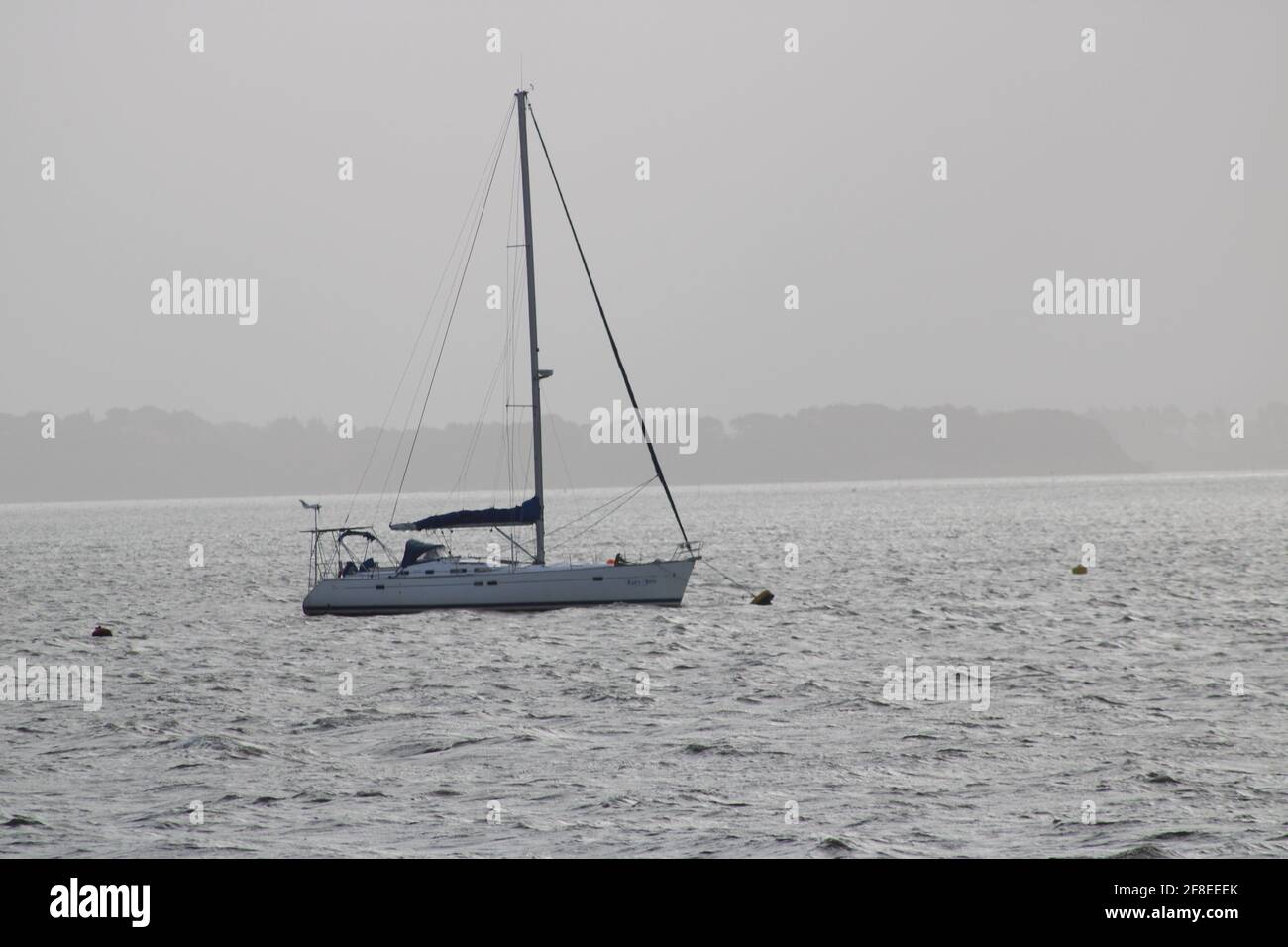 White sailing boat on wavy sea Stock Photo - Alamy
