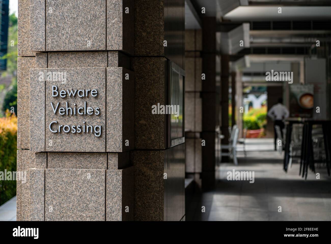 Beware Vehicles Crossing sign on the wall Stock Photo - Alamy Beware Vehicles Crossing sign on the wall Stock Photo - Alamy