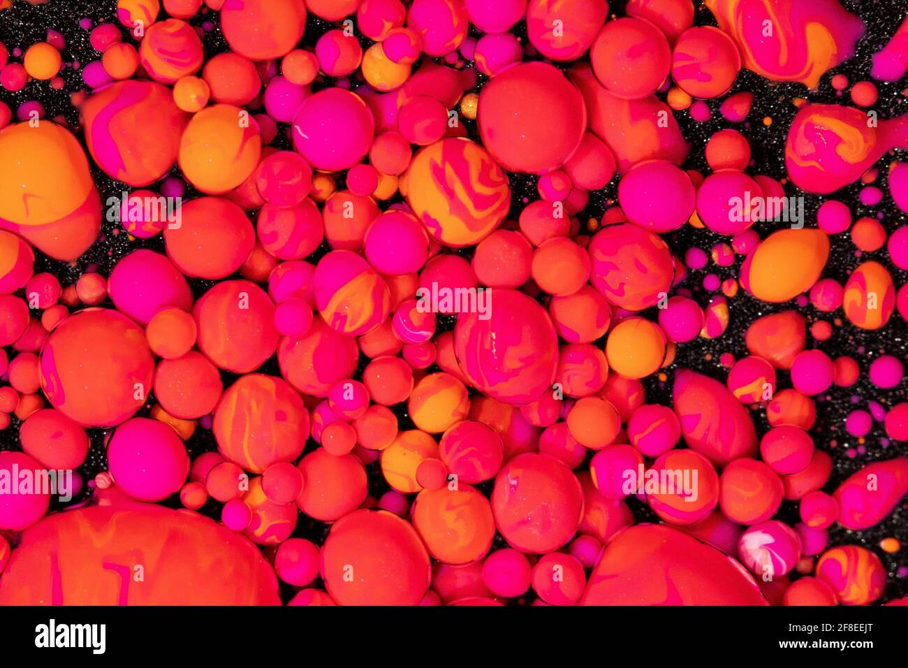 Top view of colorful vibrant rocks on a dark surface for wallpapers and ...