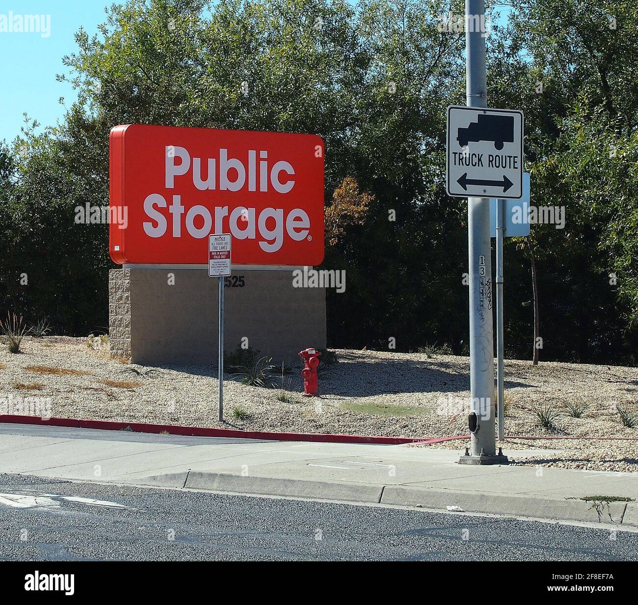 Public Storage and truck route signs in California Stock Photo - Alamy