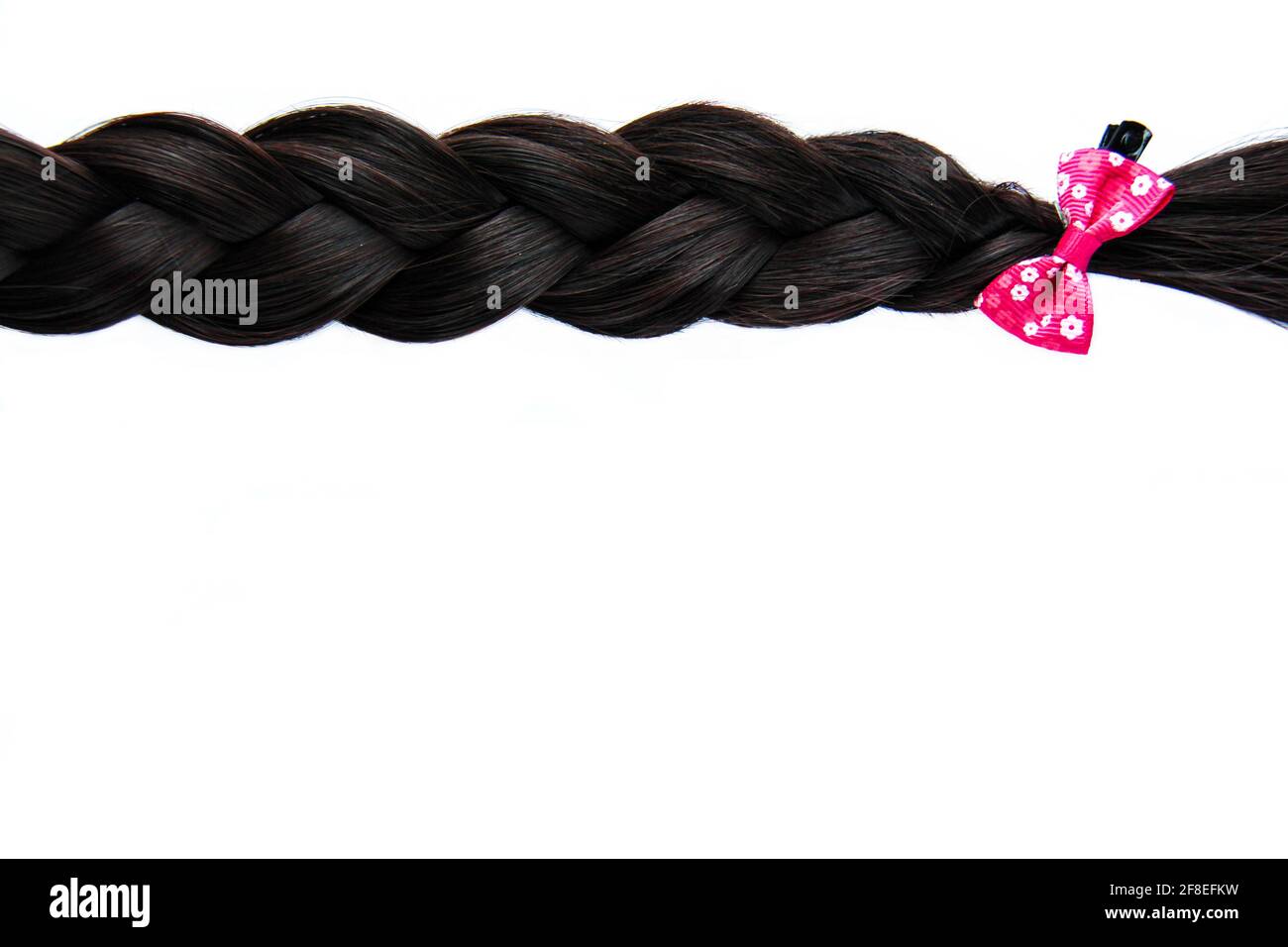 Black braided hair isolated on white background. Brunette natural ...