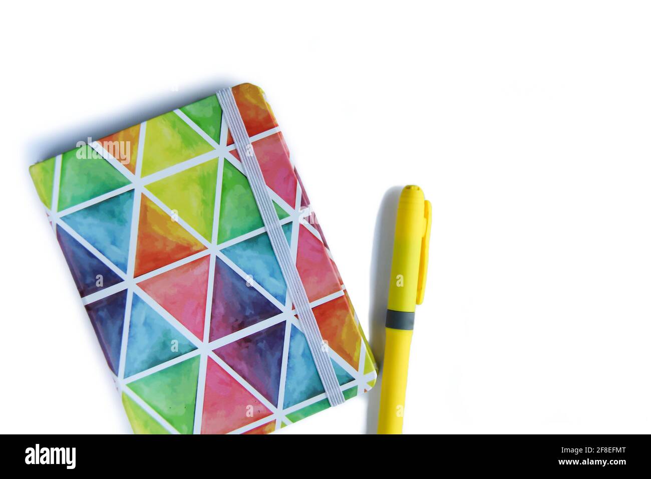 Colorful notebook with pen on white background. Rainbow colors Stock ...