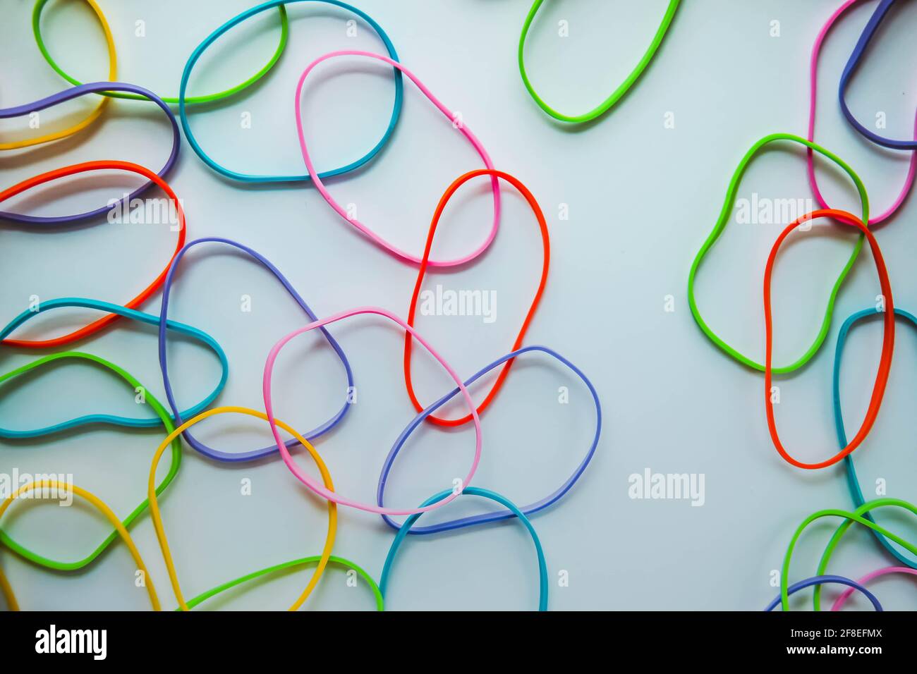 Top view of colorful rubber bands isolated on white. Rainbow elastic ...