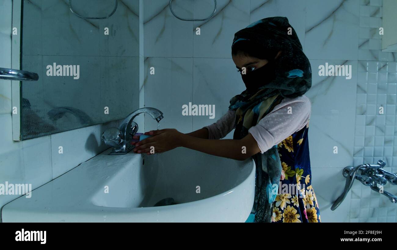 Masked Children washing hands during coronavirus pandemic. Hand wash ...