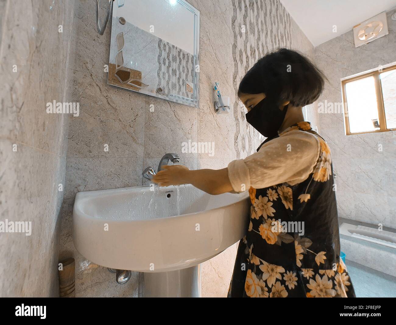 Masked Children washing hands during coronavirus pandemic. Hand wash ...