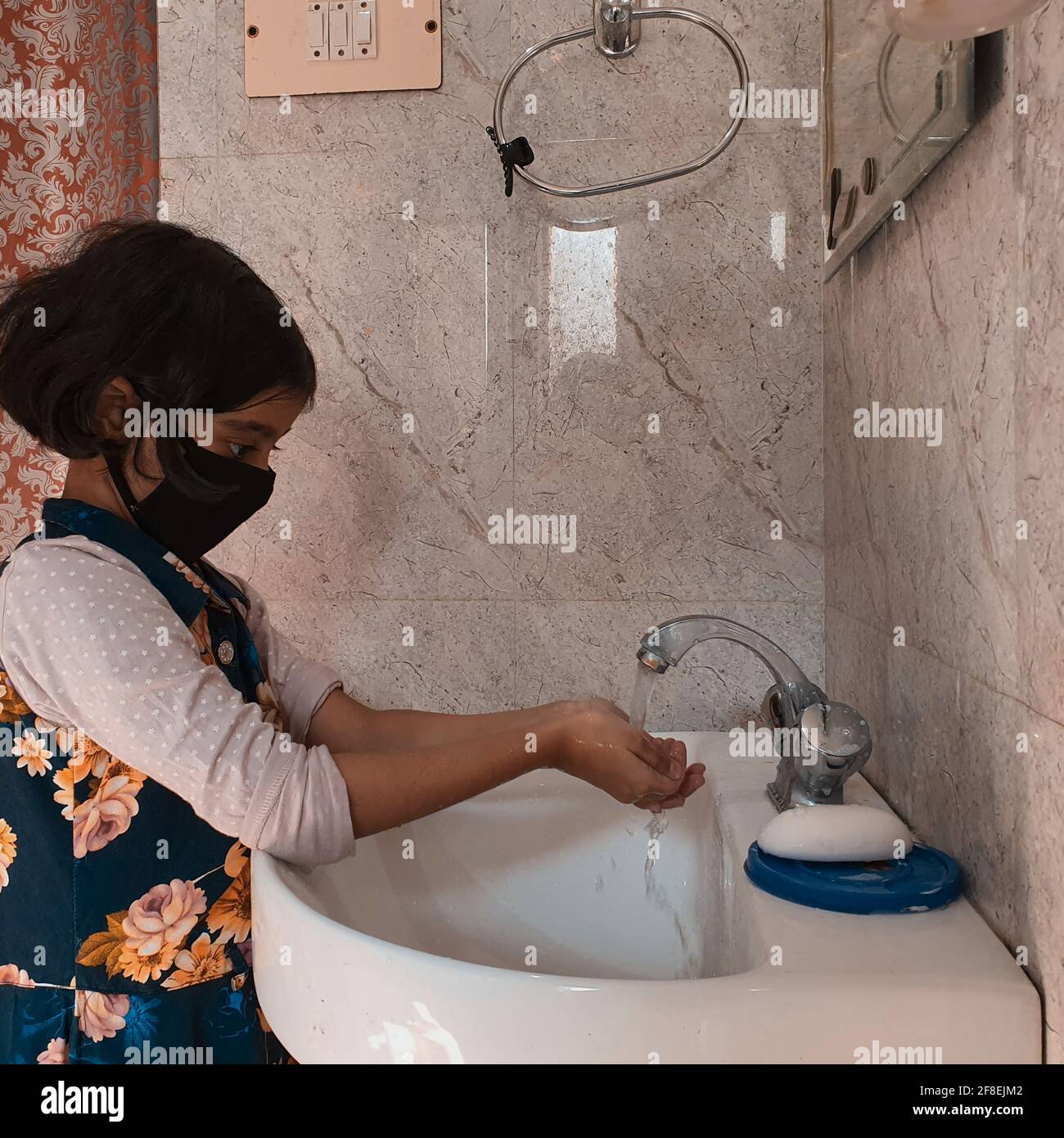 Masked Children washing hands during coronavirus pandemic. Hand wash ...