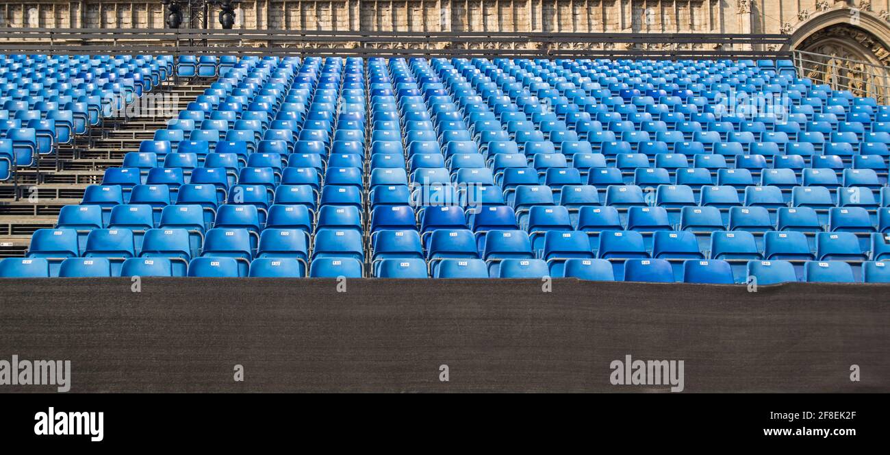 Empty rows of chairs, seats in the concert hall, in the sports hall ...