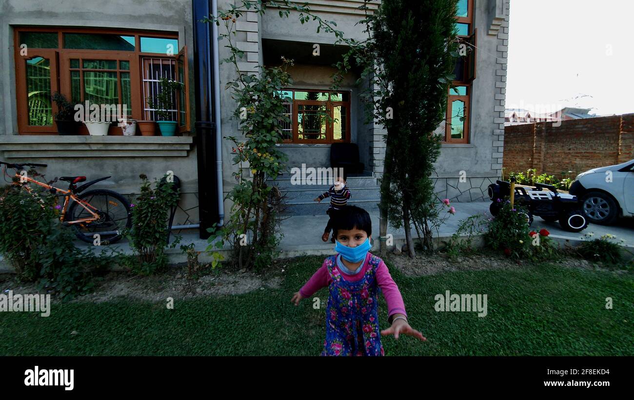 Masked kids playing Stock Photo - Alamy