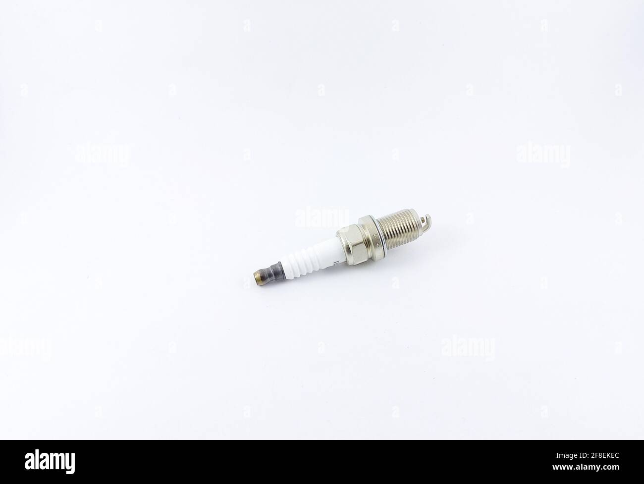 Closeup shot of a single spark plug isolated on white background Stock ...
