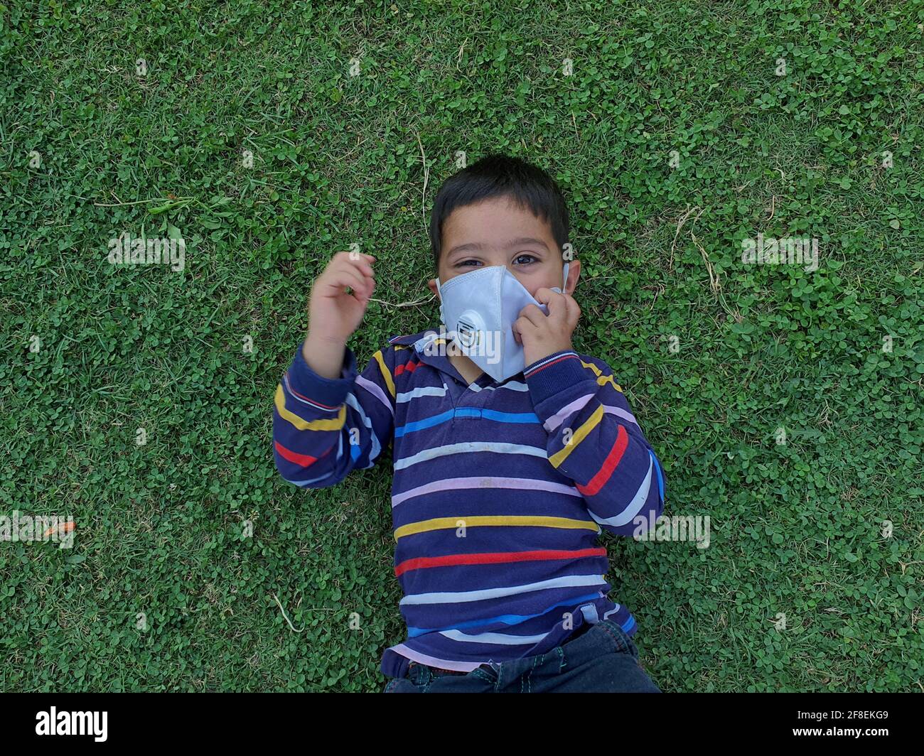 Masked kids playing Stock Photo - Alamy