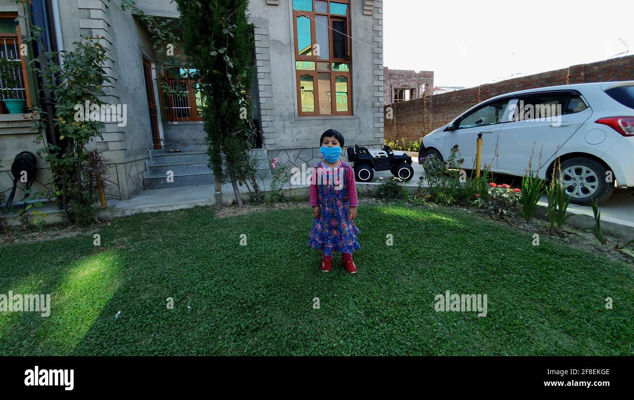 Masked kids playing Stock Photo - Alamy