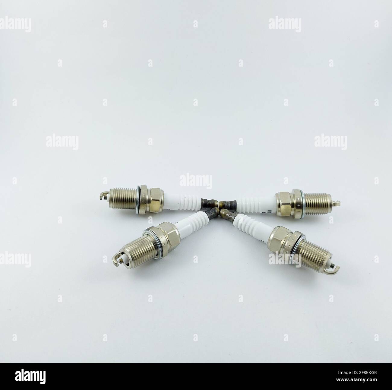 Closeup shot of new spark plugs isolated on white background Stock ...
