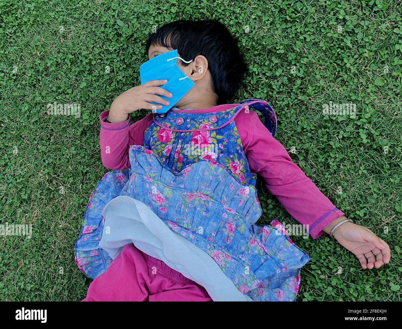 Masked kids playing Stock Photo - Alamy