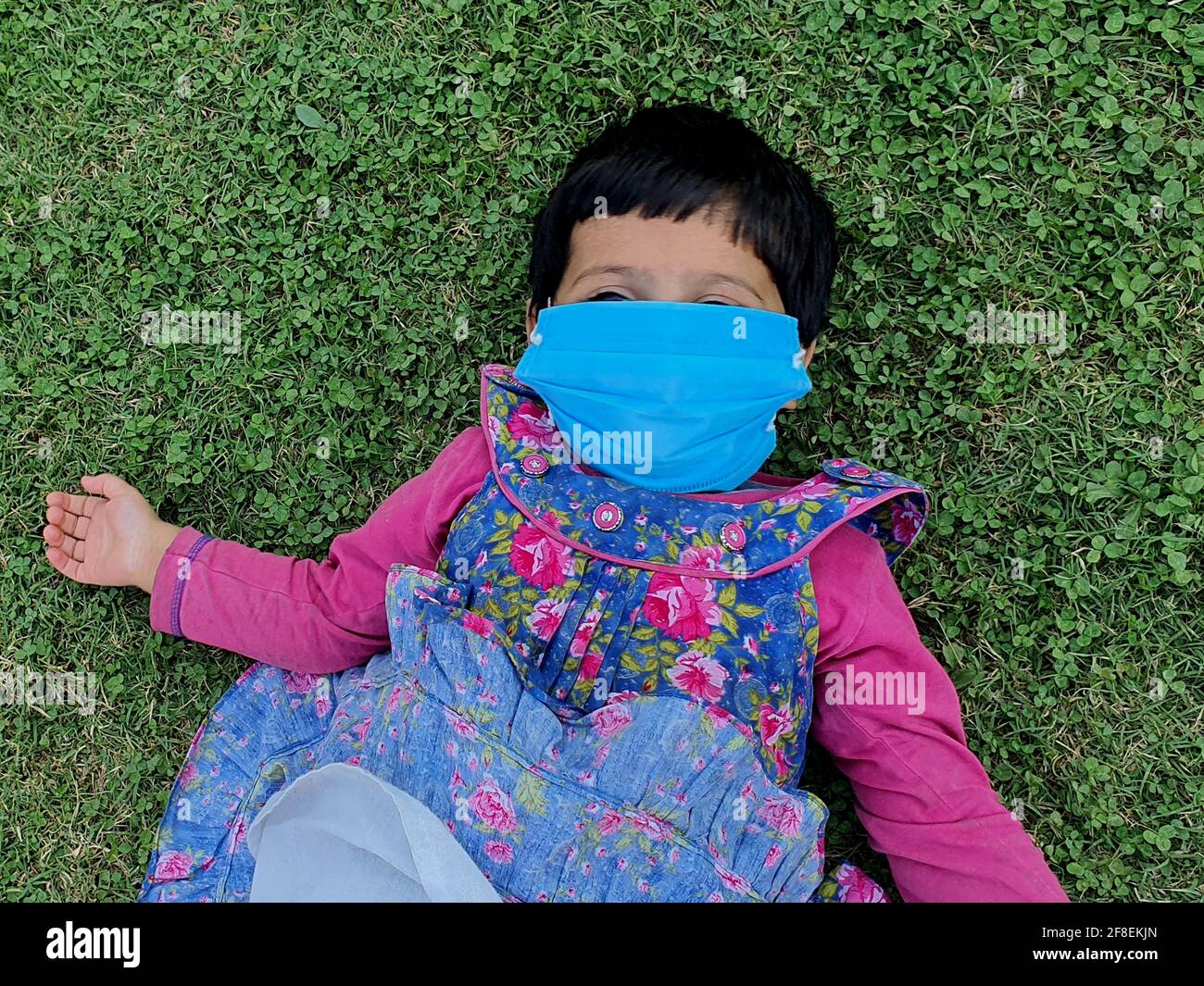 Masked kids playing Stock Photo - Alamy