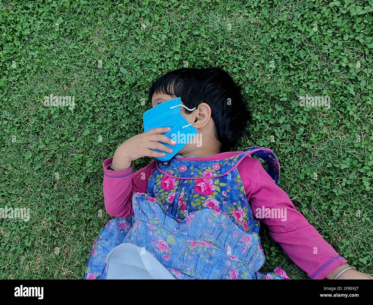 Masked kids playing Stock Photo - Alamy