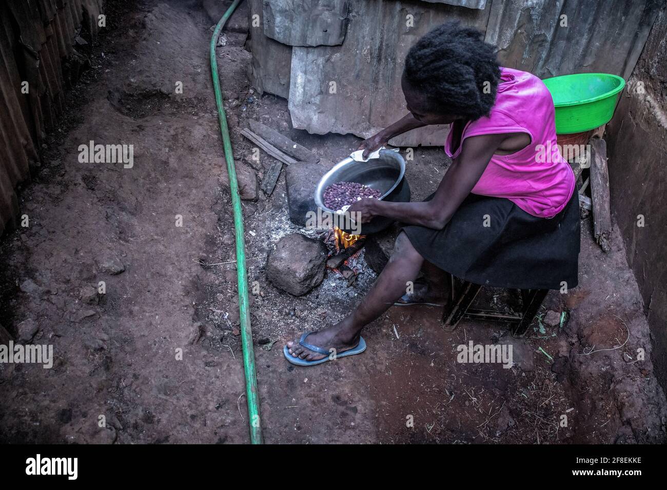 Juliet prepares roasted groundnuts for her late night sales. 23-year ...