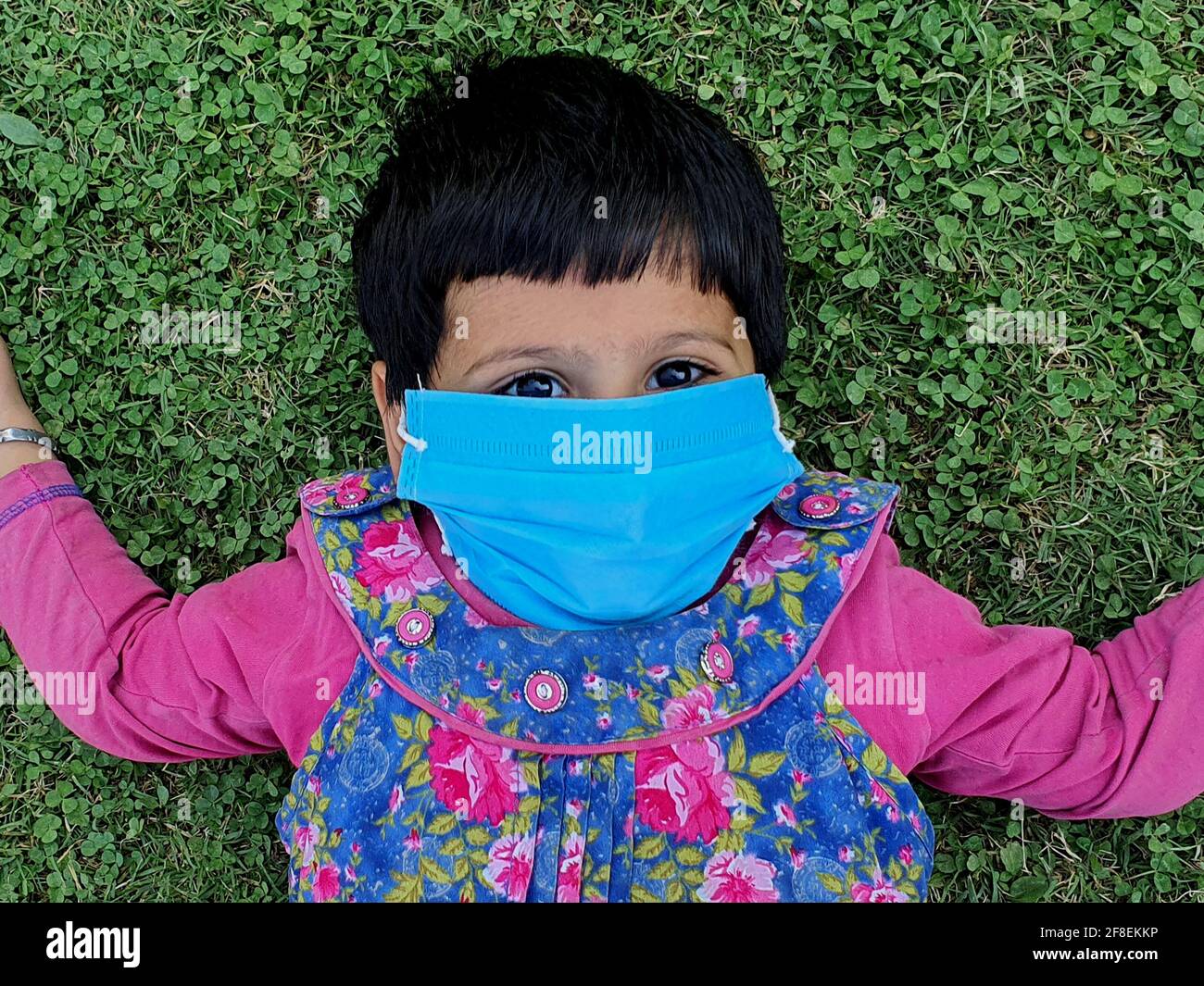 Masked kids playing Stock Photo - Alamy