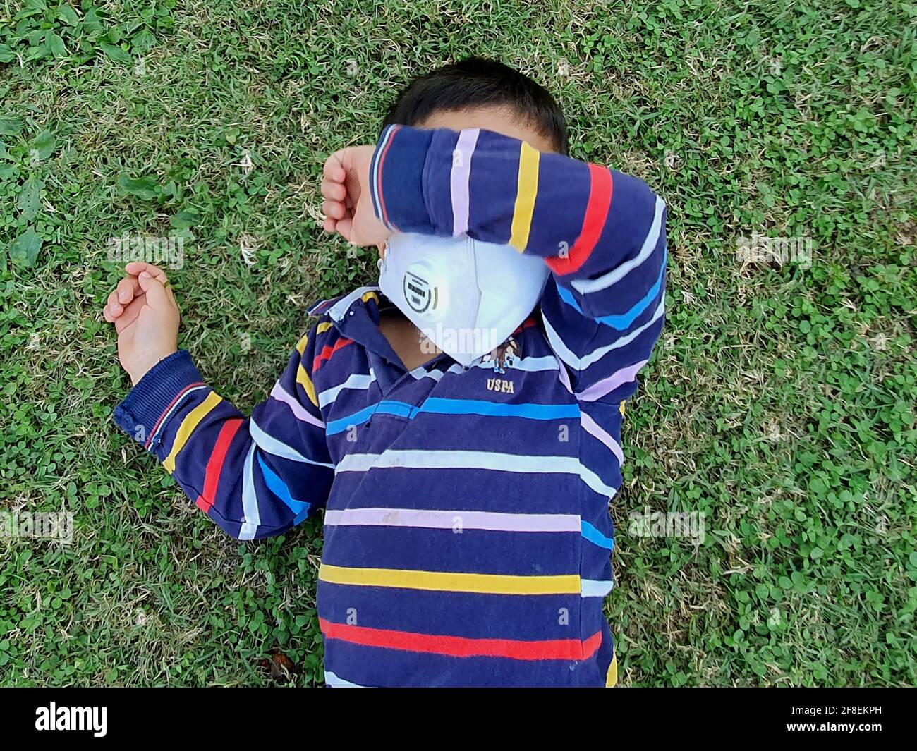 Masked kids playing Stock Photo - Alamy