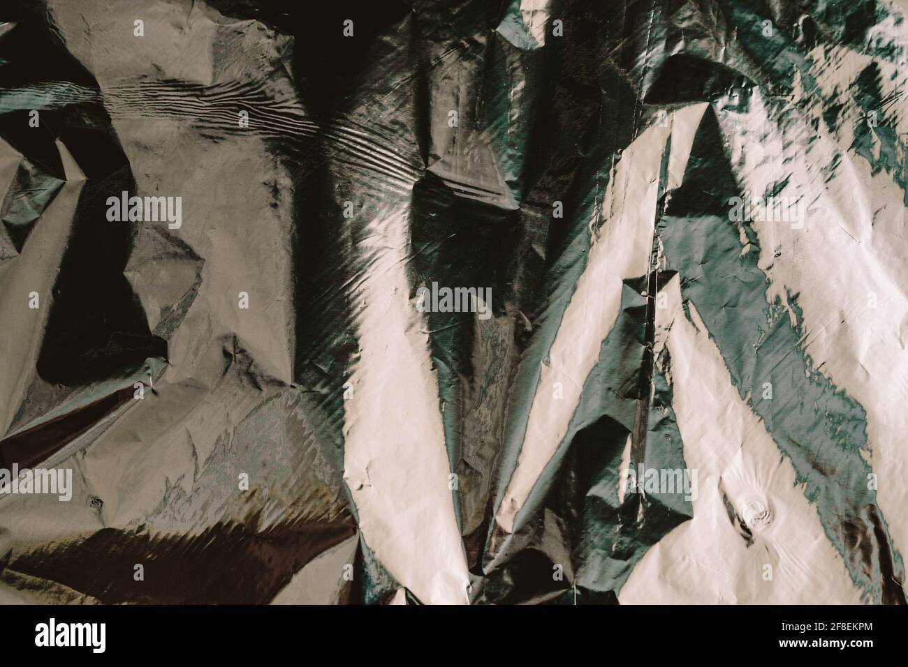 Crumpled foil texture. Crumpled paper is shiny with a color tint Stock ...