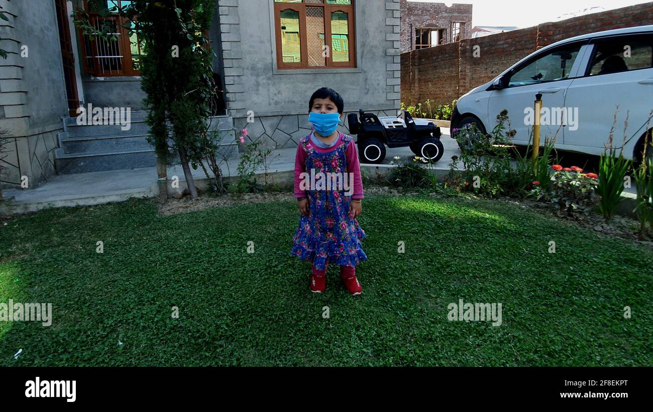 Masked kids playing Stock Photo - Alamy
