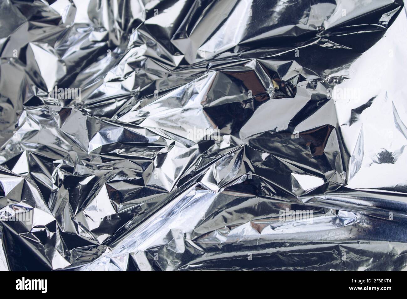Crumpled foil texture. Crumpled paper is shiny with a color tint Stock ...
