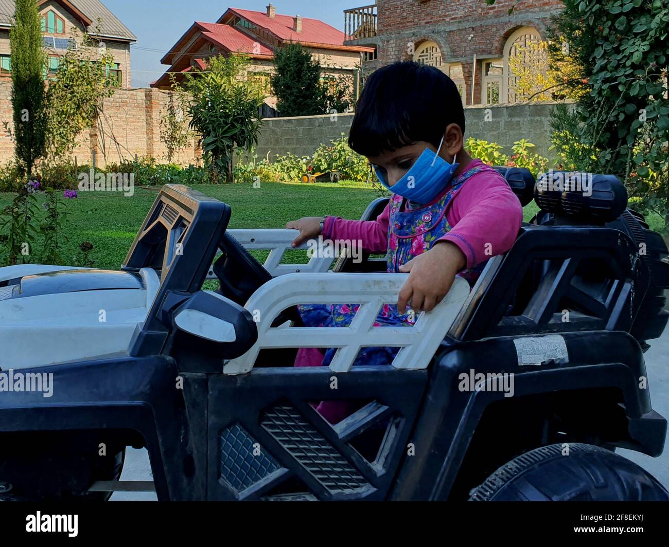 Masked kids playing Stock Photo - Alamy