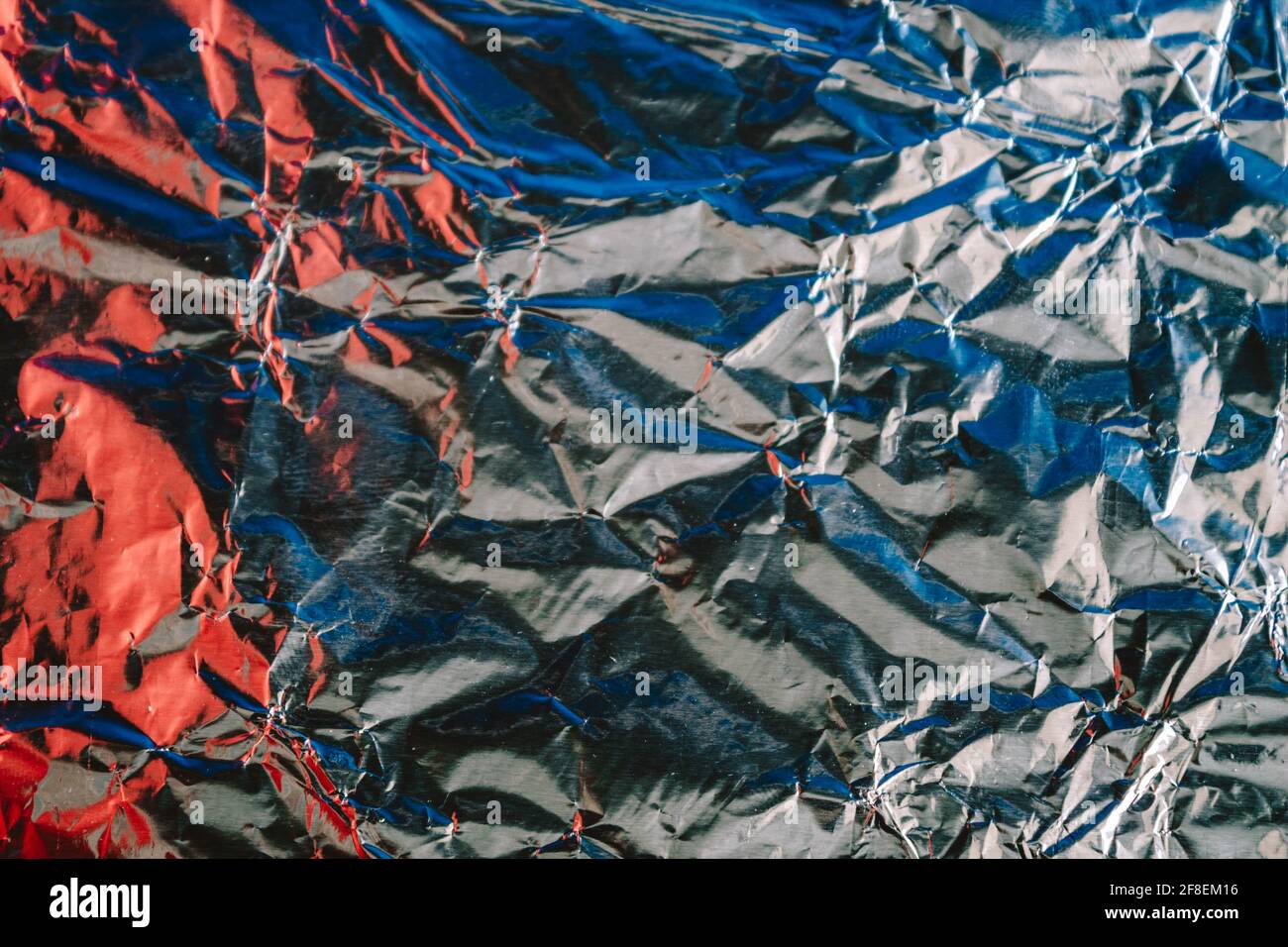 Crumpled foil texture. Crumpled paper is shiny with a color tint Stock ...