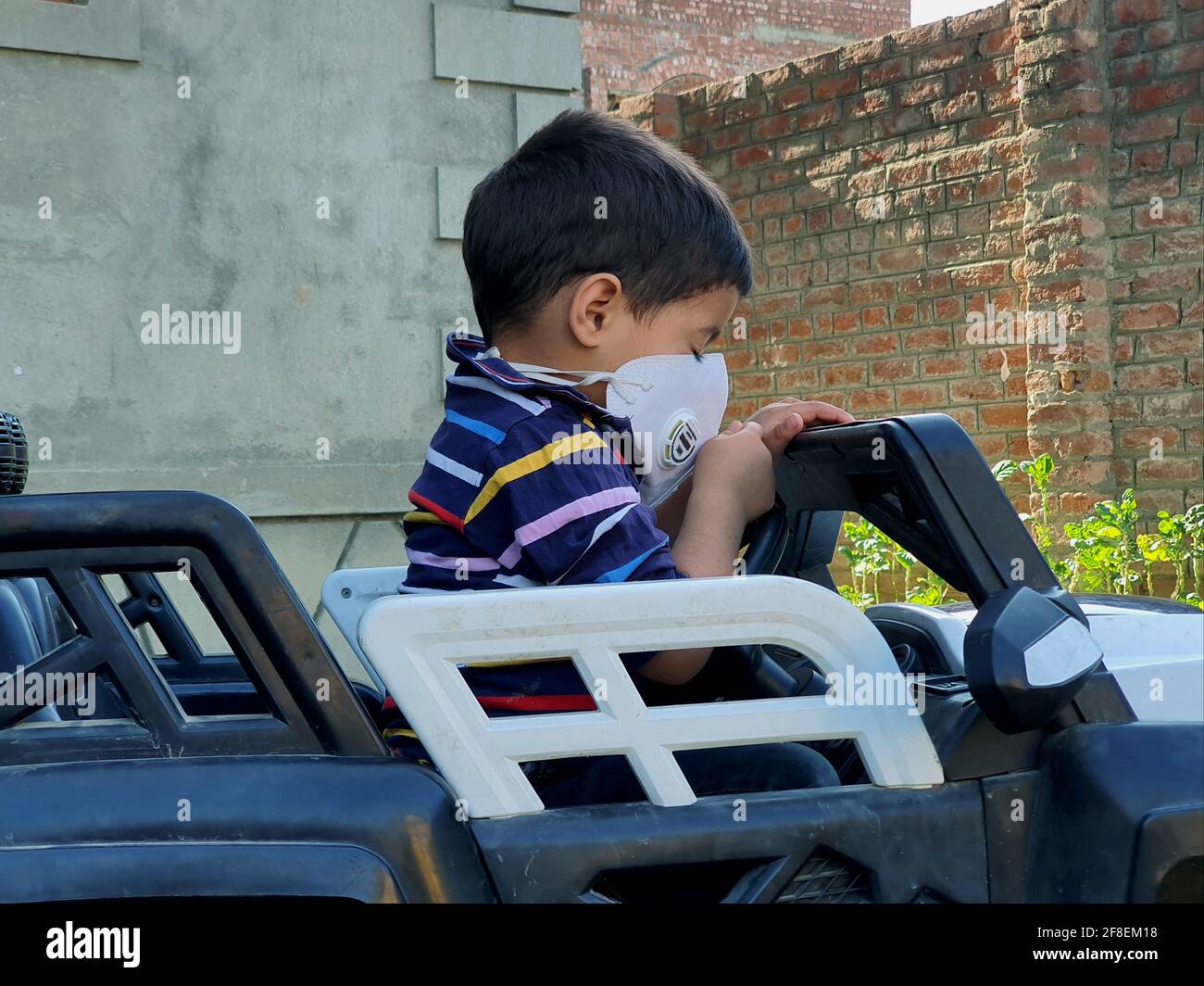 Masked kids playing Stock Photo - Alamy