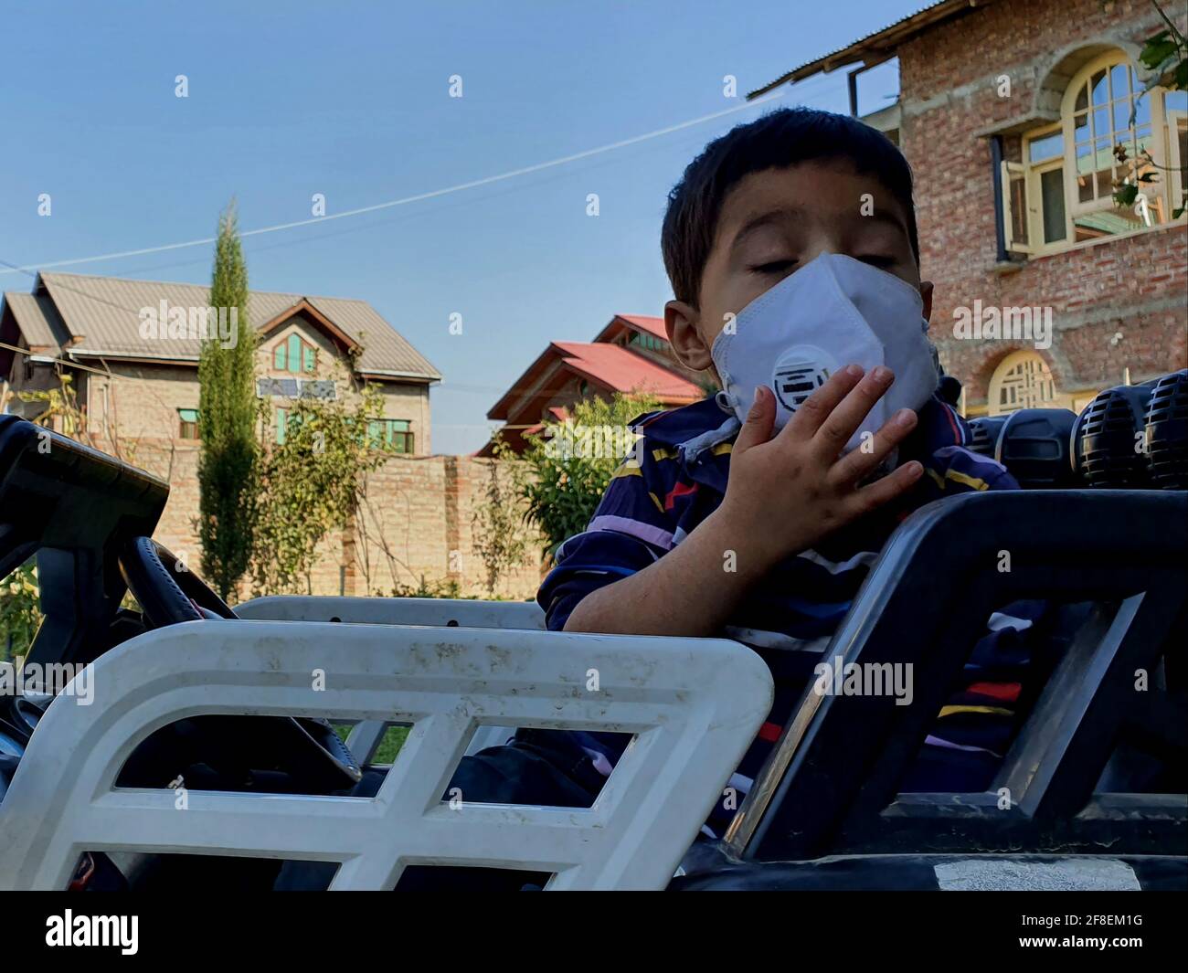 Masked kids playing Stock Photo - Alamy