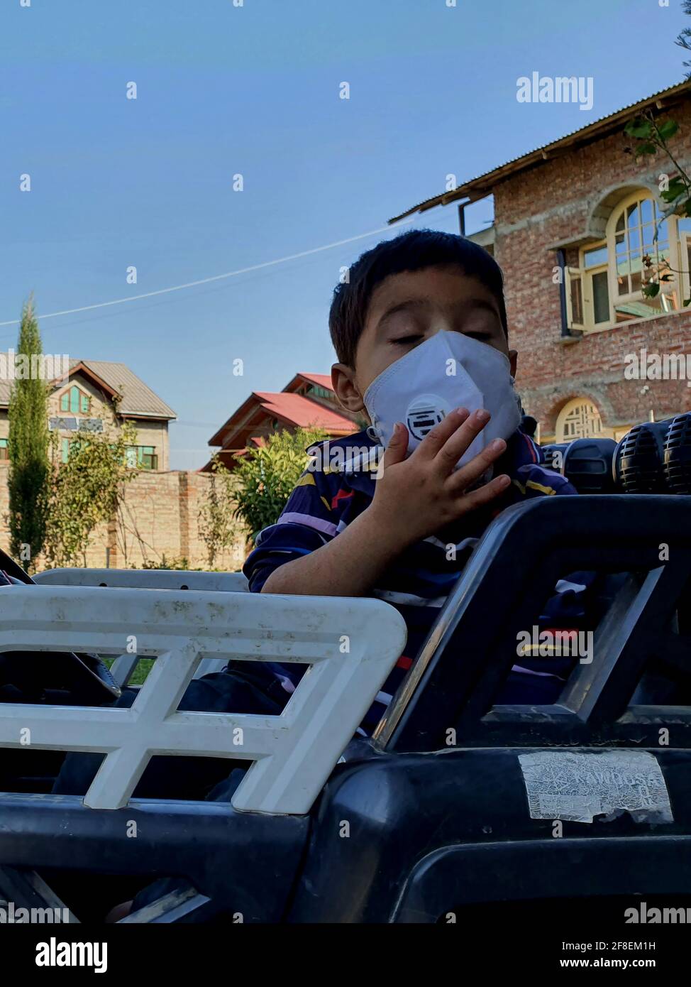 Masked kids playing Stock Photo - Alamy