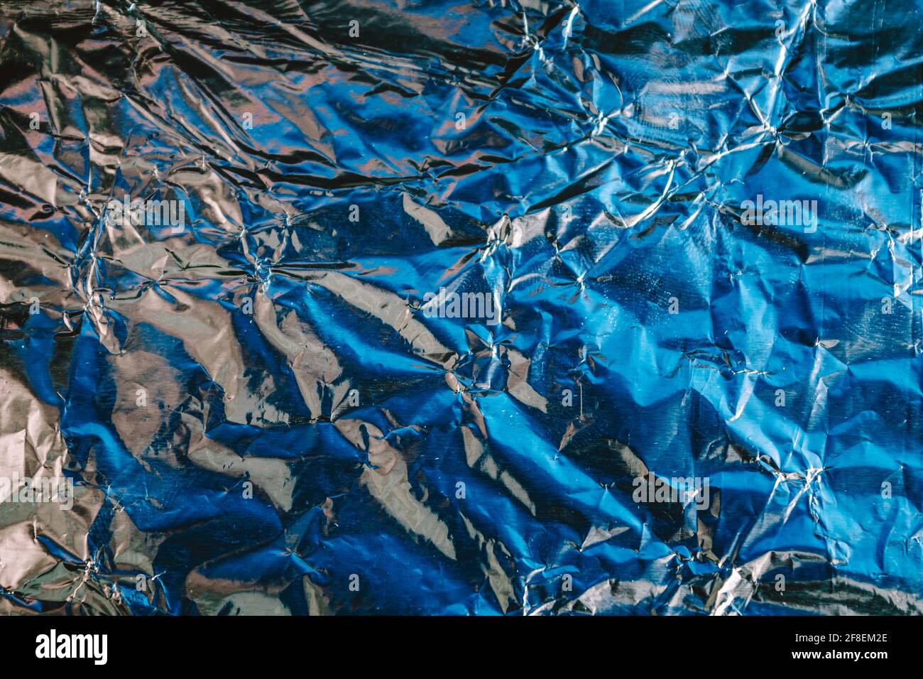 Crumpled foil texture. Crumpled paper is shiny with a color tint Stock ...