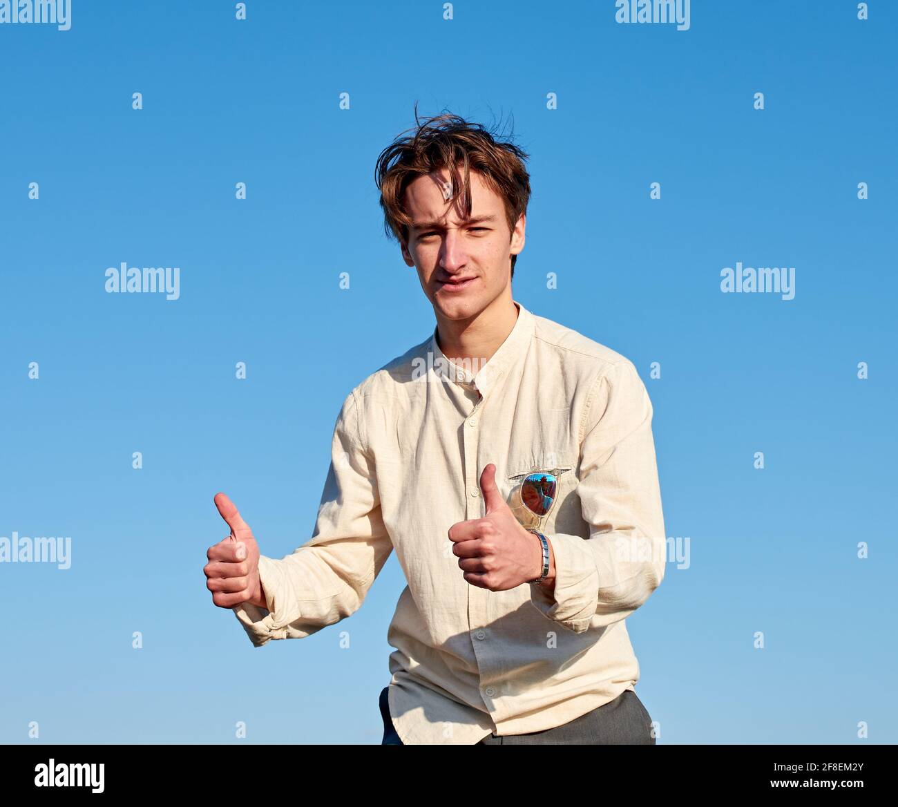 Caucasian man from Spain making a thumbs up sign with both hands on ...