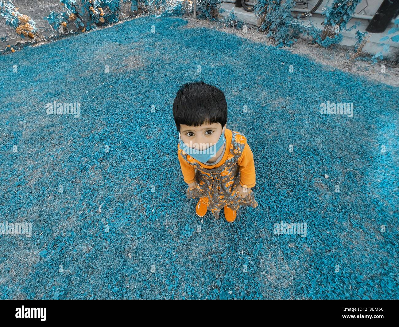 Masked kids playing Stock Photo - Alamy