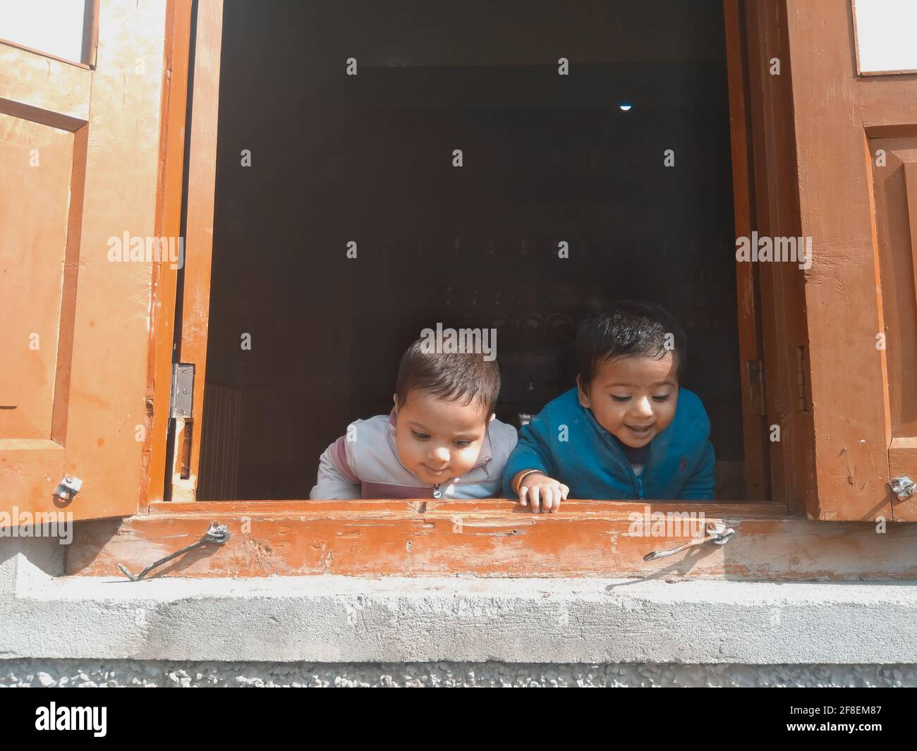 Masked kids playing Stock Photo - Alamy