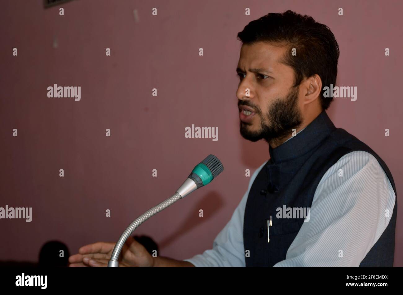 Man asian is giving lecture in a public hall during a function Stock ...
