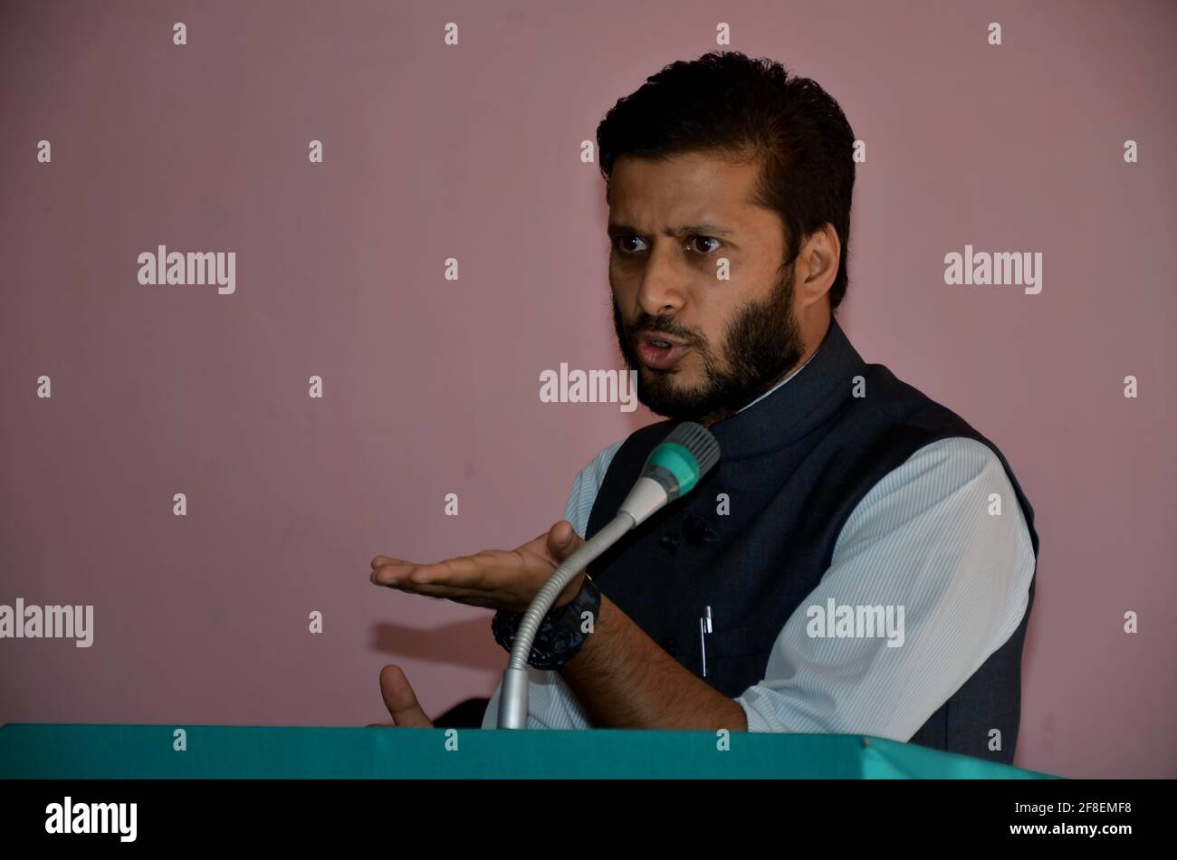 Man asian is giving lecture in a public hall during a function Stock ...